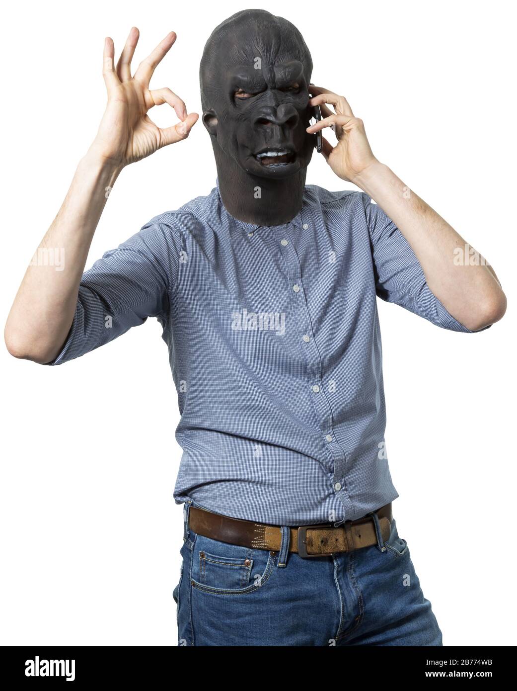 Male in a black angry mask talking on the phone and showing the OK ...