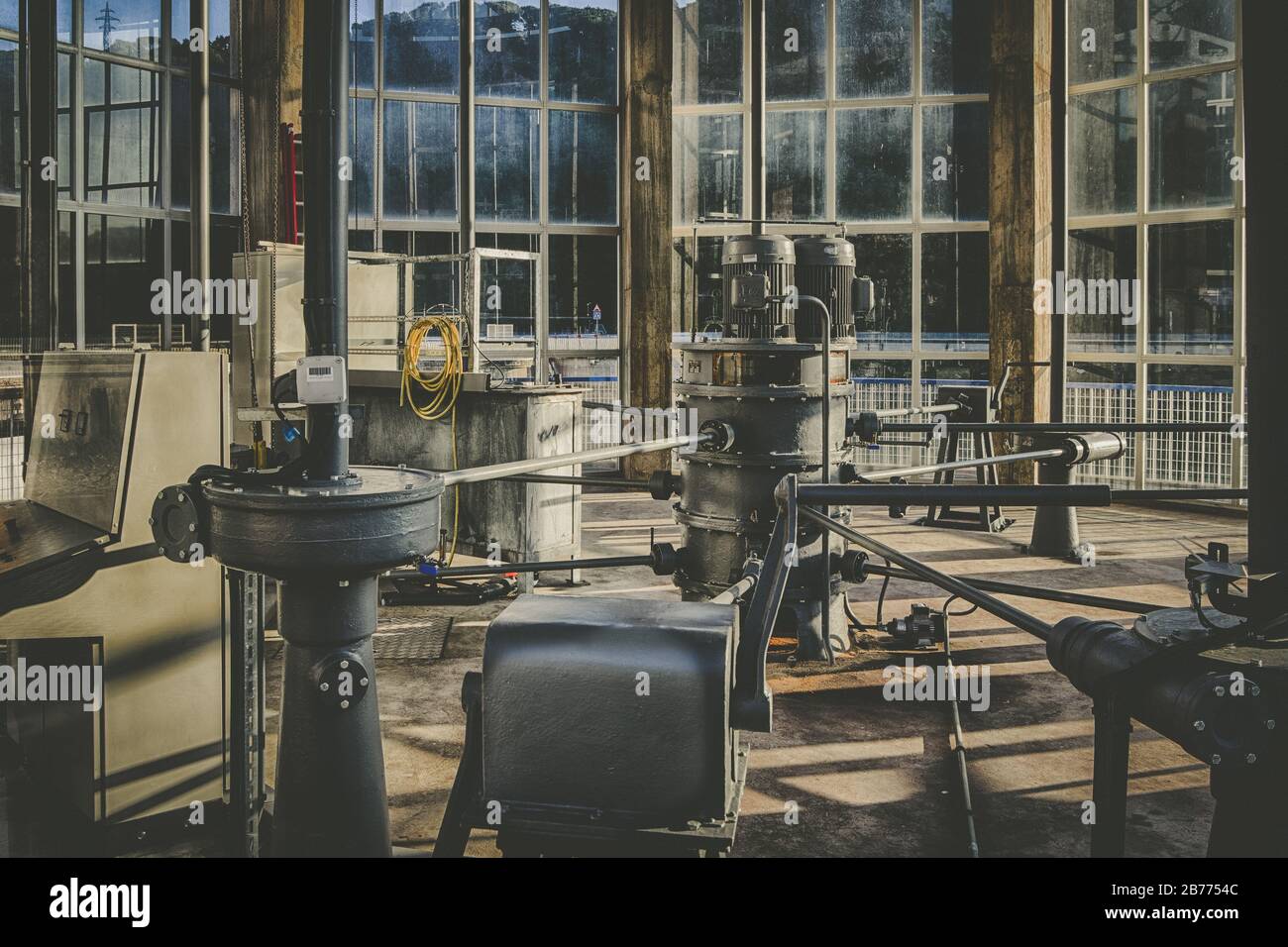 Inside of an old factory with mechanisms Stock Photo - Alamy