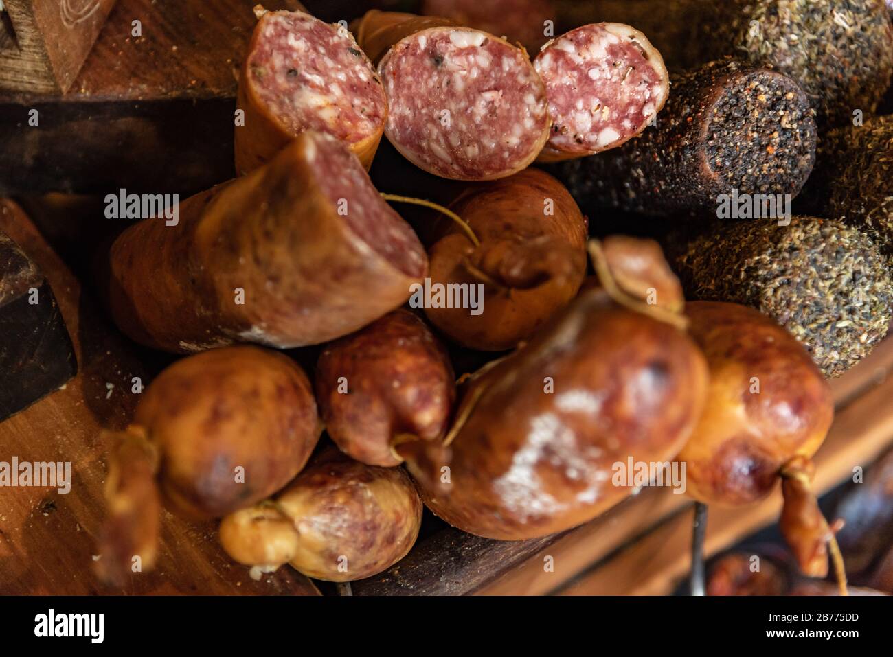 Variety of processed cold meat products with condiments. Assortment of ...