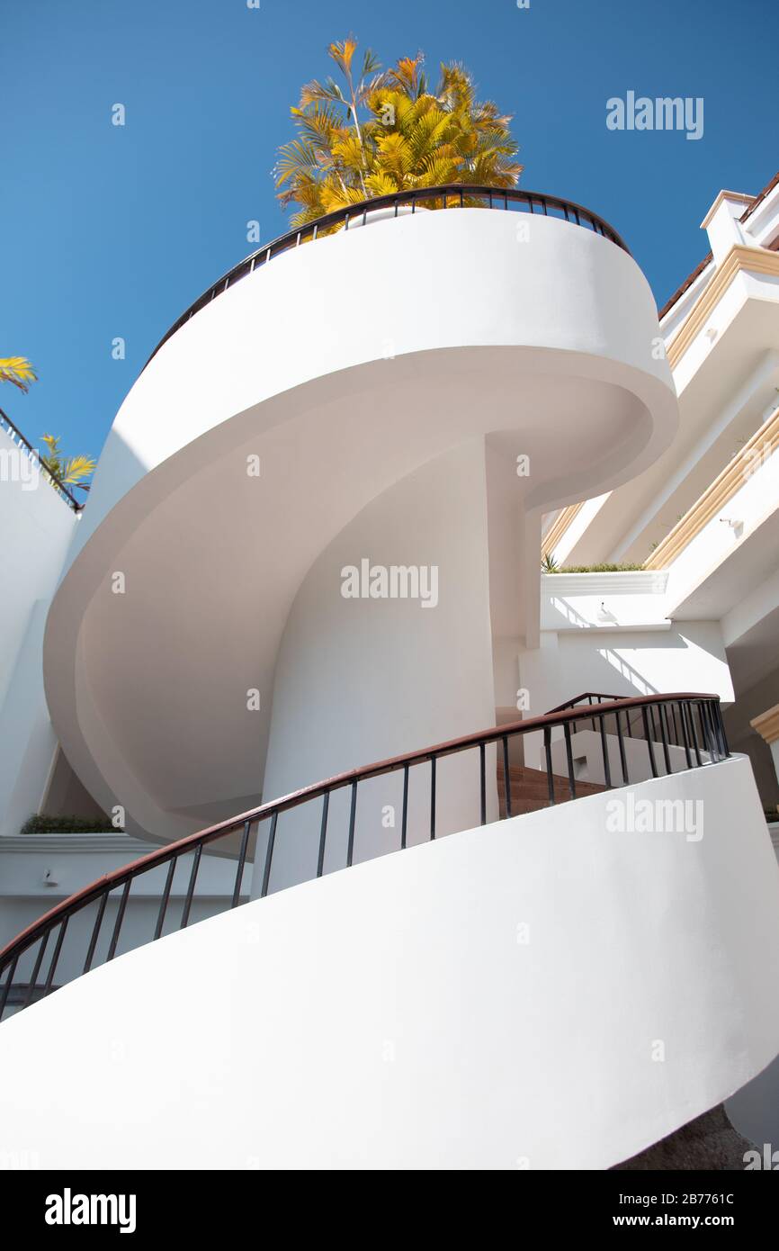 Vertical picture of a spiral staircase of a building under the sunlight ...