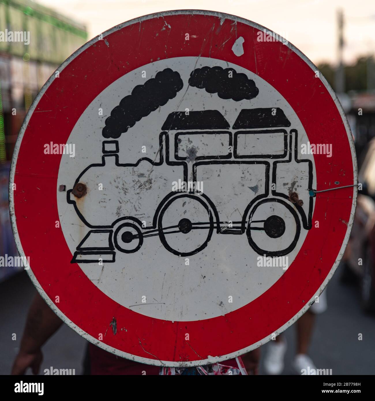 Old round-shaped poster in red and black white colors, indicating that ...