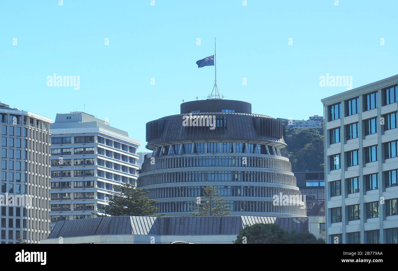 The Beehive, New Zealand's parliament in Wellington, flies the flag at ...