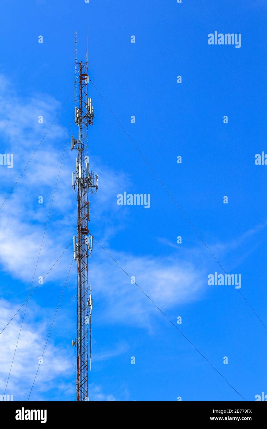 Communication tower on blue sky background background Stock Photo - Alamy