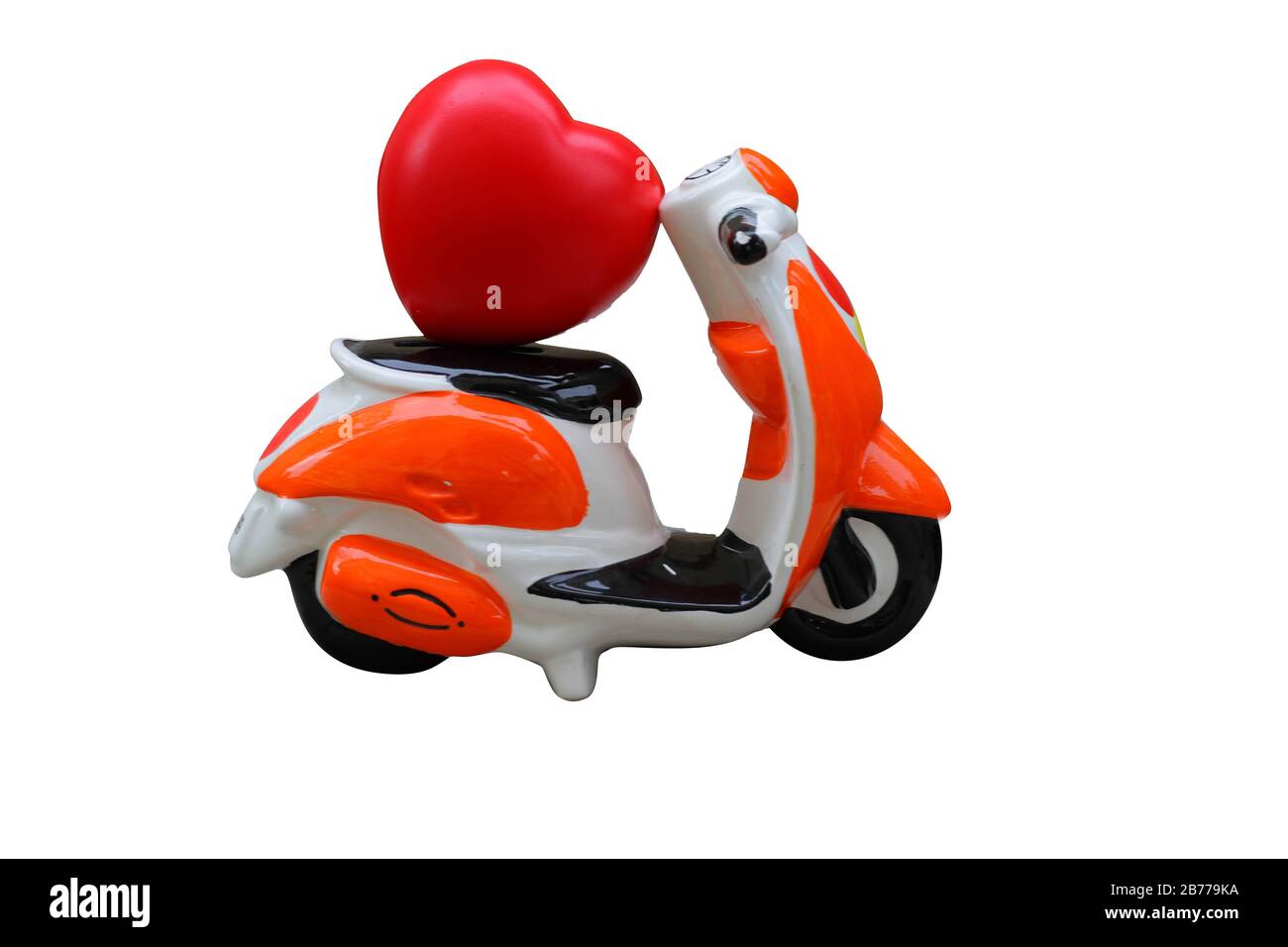 Motorcycle toy with heart isolated on white background.This had ...