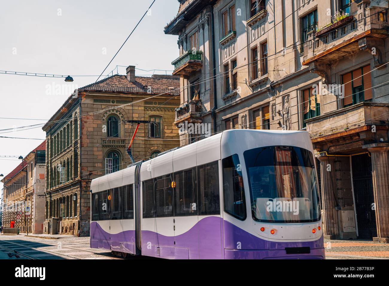 Old town street with modern tram in Timisoara, Romania Stock Photo - Alamy