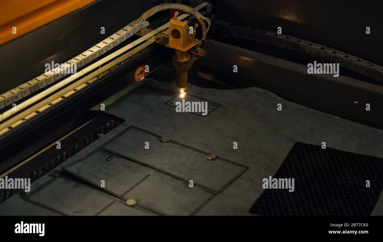 Laser cutting beam artificial leather High precision. Modern machine ...