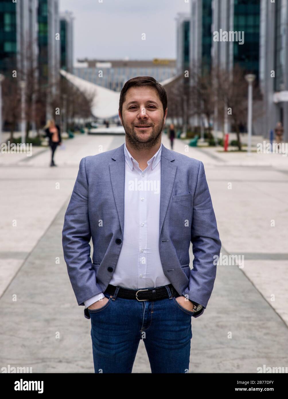 Businessman Outdoors in front of Office Building Standing Proud and ...