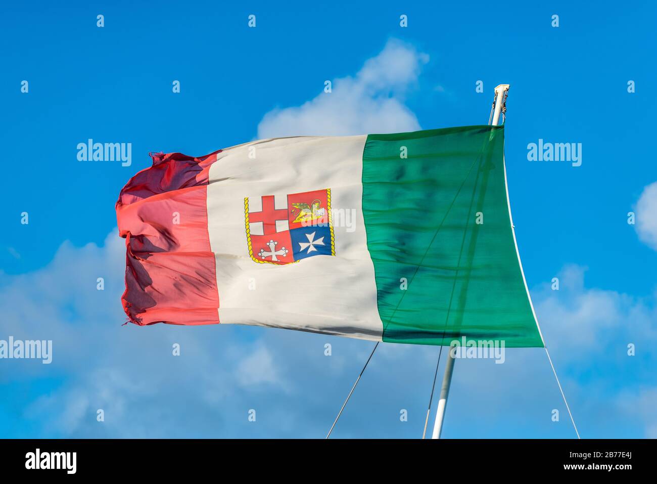 Nautical flag of Italy over a blue sky background on a Ship Stock Photo ...