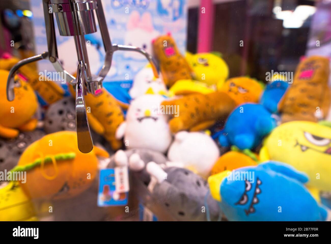 Close up view of claw vending machine commonly seen in Asian country ...