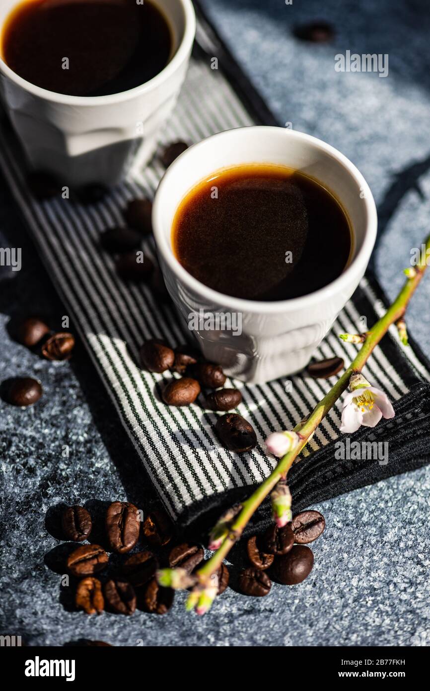 Two mags of americano coffee as a morning concept on stone background ...