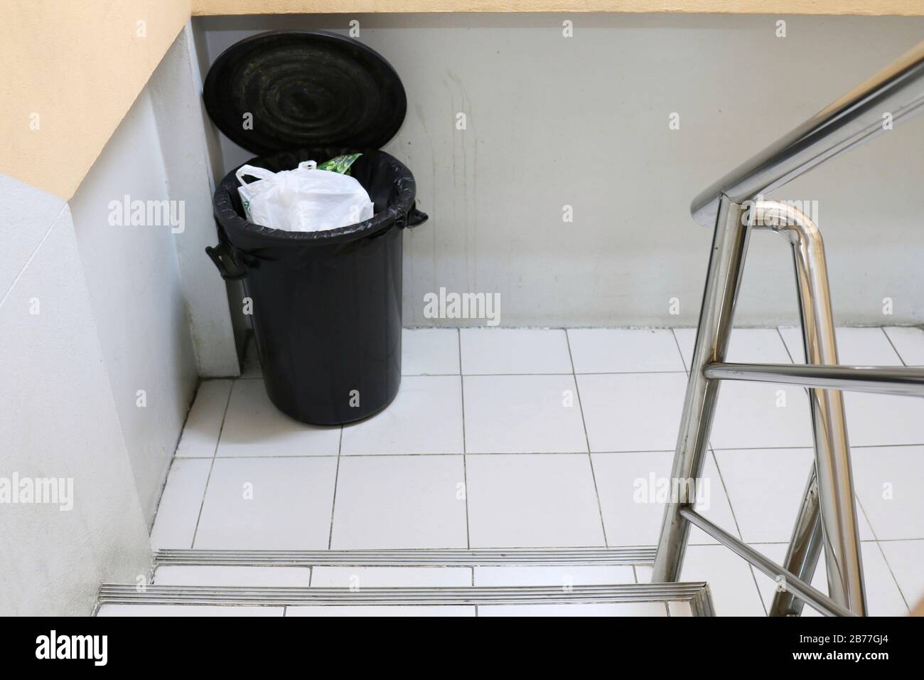 Bin Garbage or Trash on sidewalks staircase side in apartment Stock ...