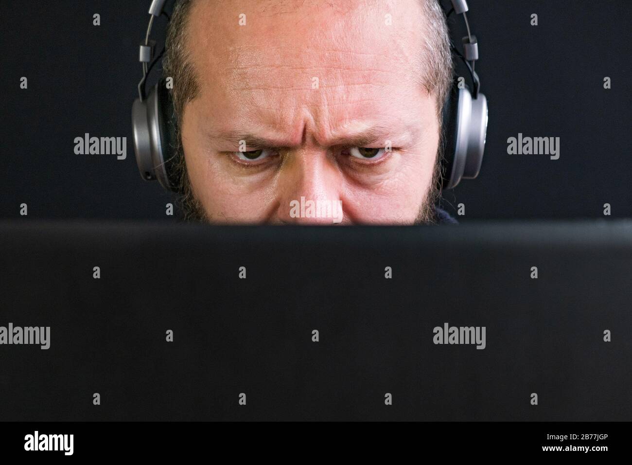 Angry man behind screen hi-res stock photography and images - Alamy