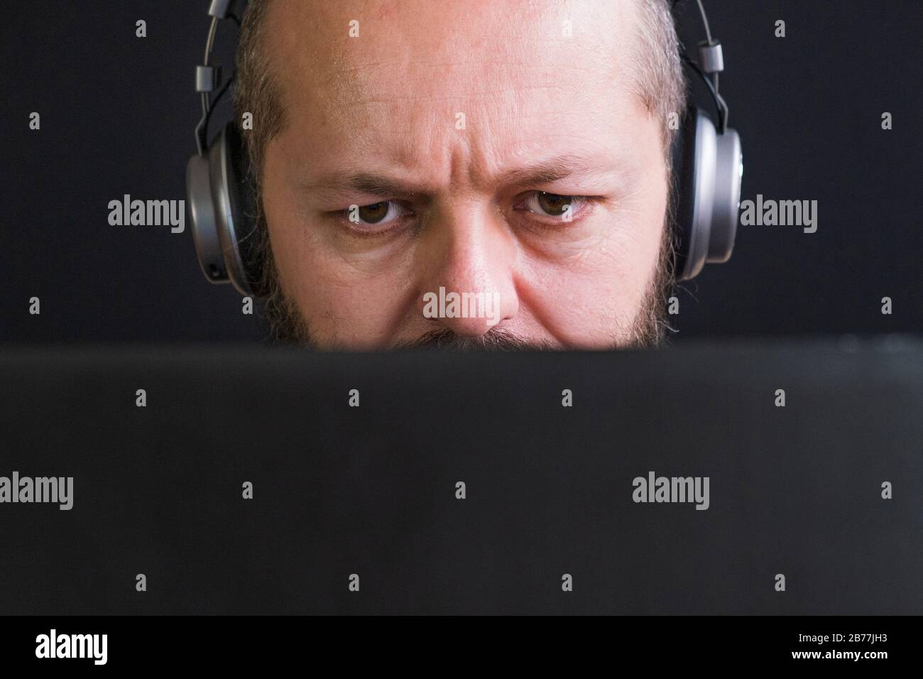 Angry man behind screen hi-res stock photography and images - Alamy