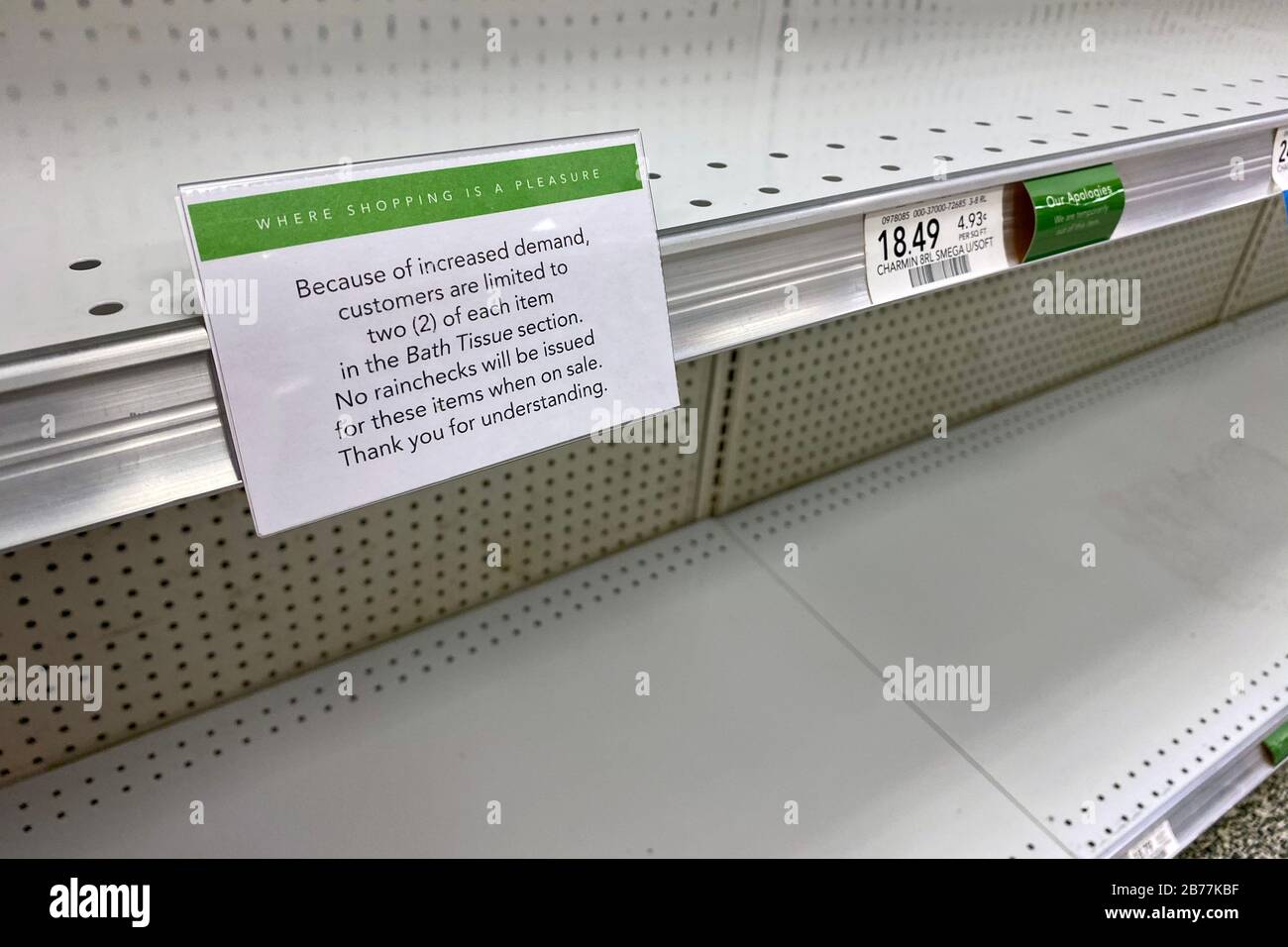 General overall of rationing sign for bath tissue and empty shelves at ...