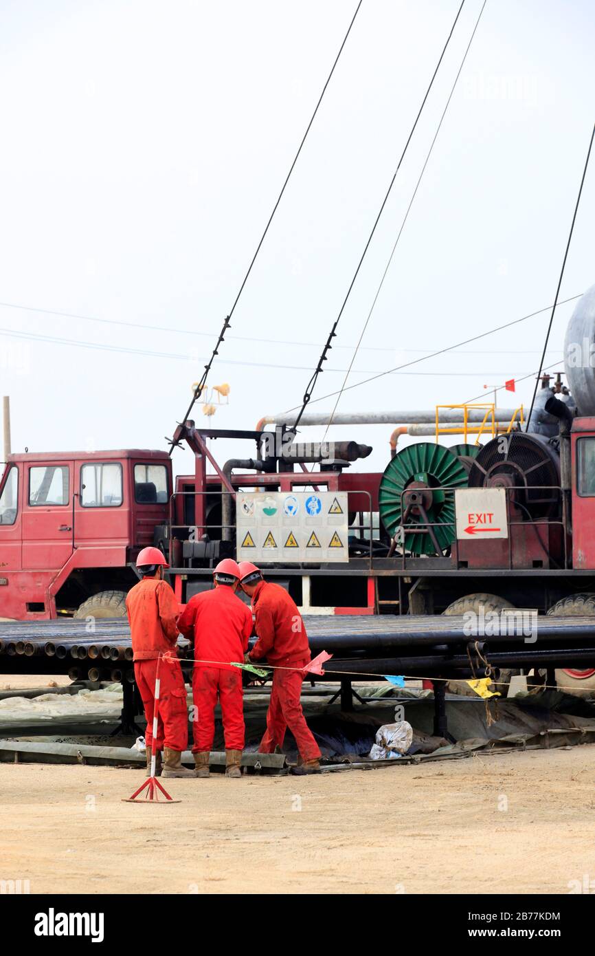 oil field, the oil workers are working Stock Photo - Alamy