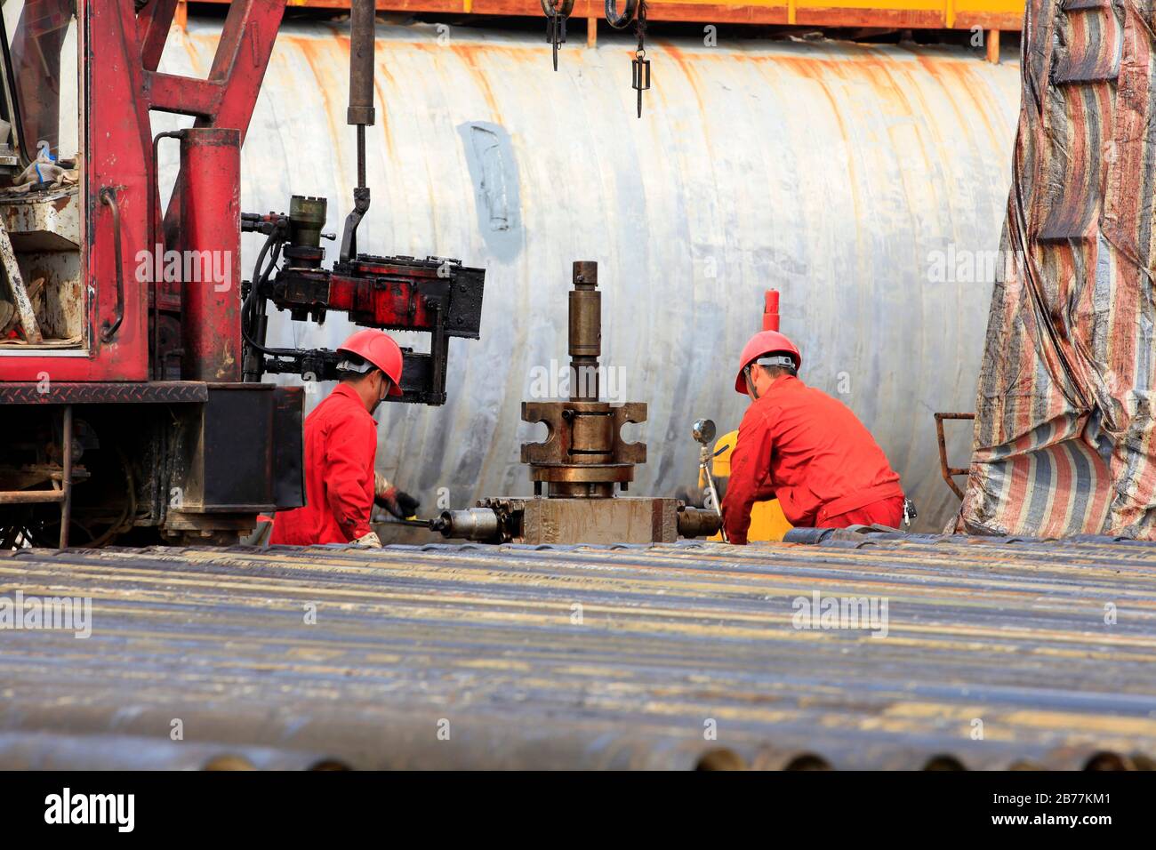 oil field, the oil workers are working Stock Photo - Alamy