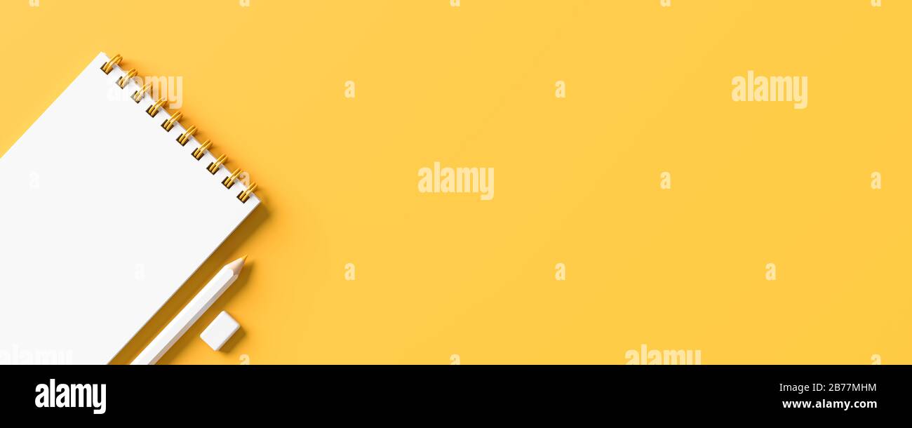 White pencil and notebook isolated on yellow background with copy space ...