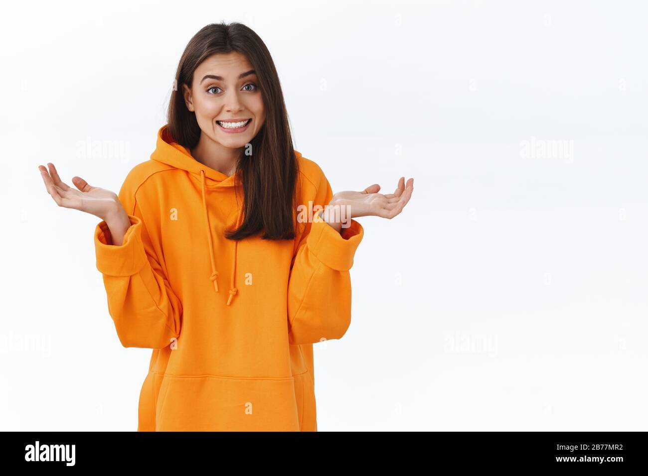 Sorry I dont know. Smiling silly young brunette girl standing ...