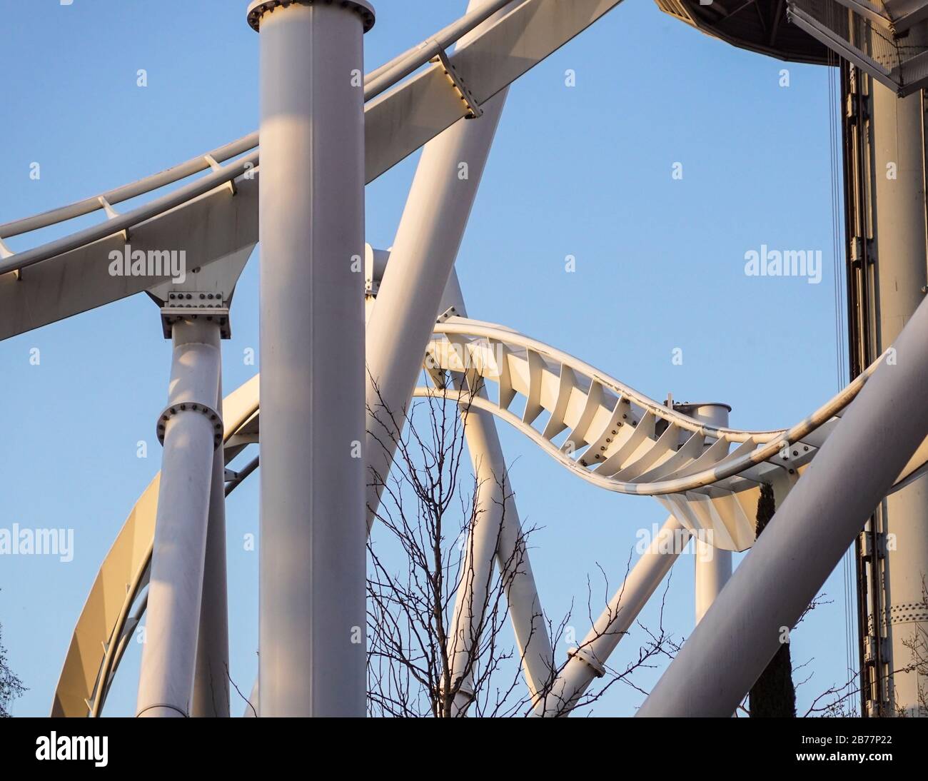 detail of curved rollercoaster track at sunset Stock Photo - Alamy
