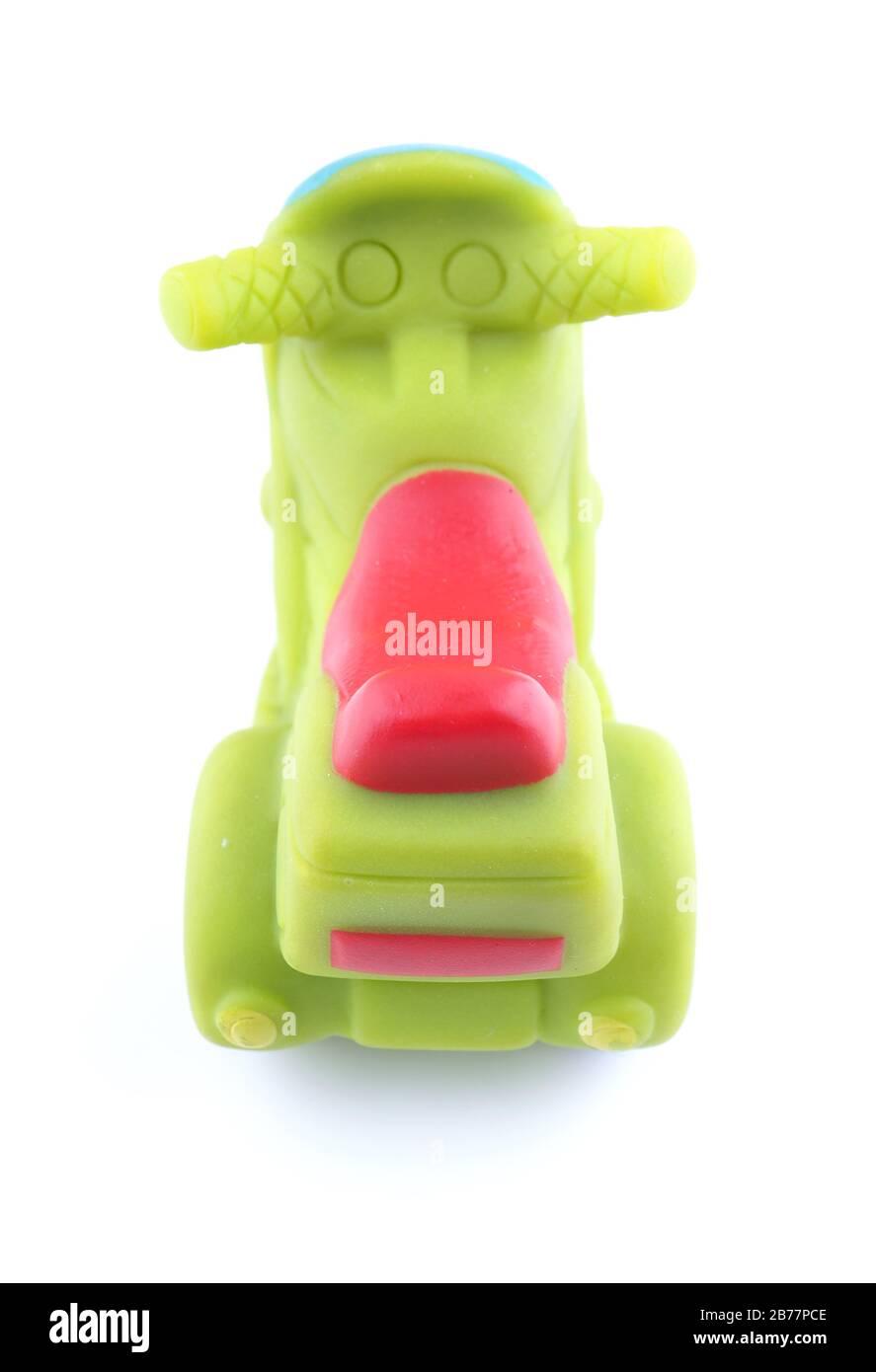 green rubber motorcycle toy on a white background Stock Photo - Alamy