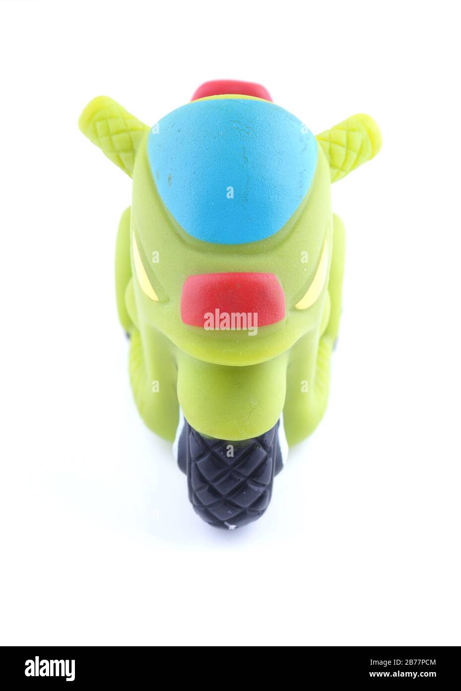 green rubber motorcycle toy on a white background Stock Photo - Alamy