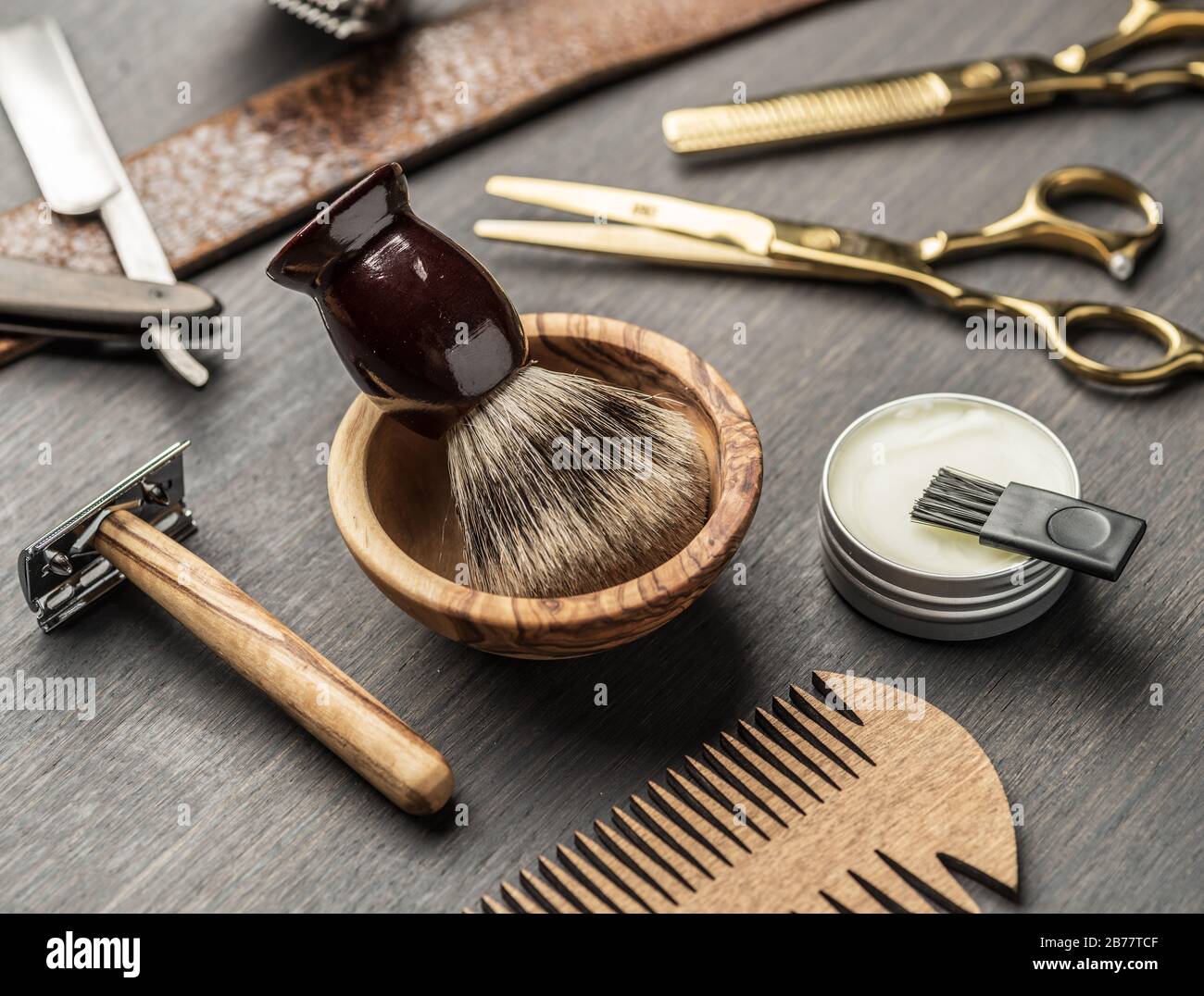 Classic grooming and hairdressing tools on wooden background. Top view ...