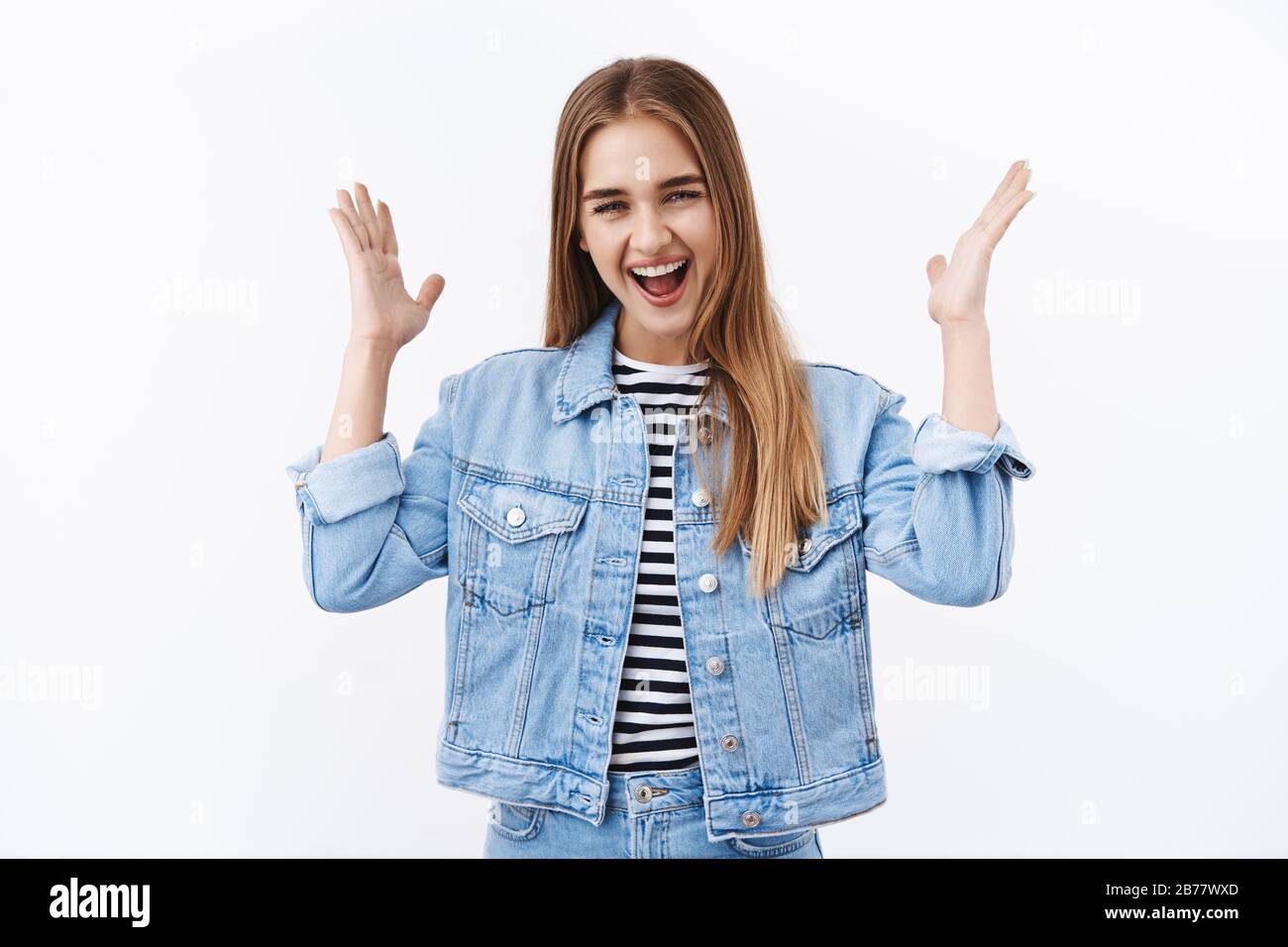 Young overwhelmed and surprised happy blond girl celebrating great news ...