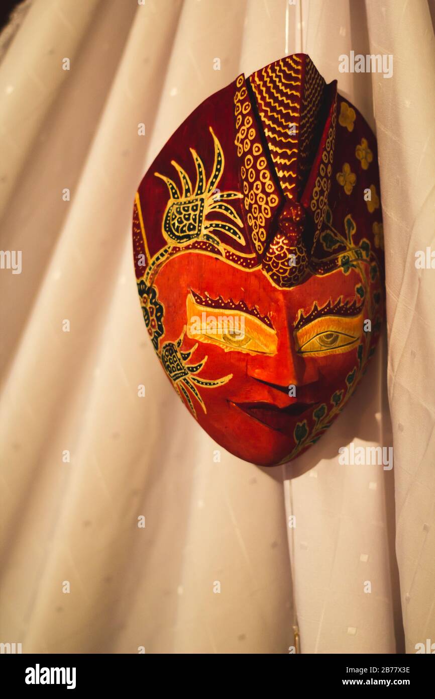Traditional Dance Accessory: Red Indonesian Wayang Mask on a white ...