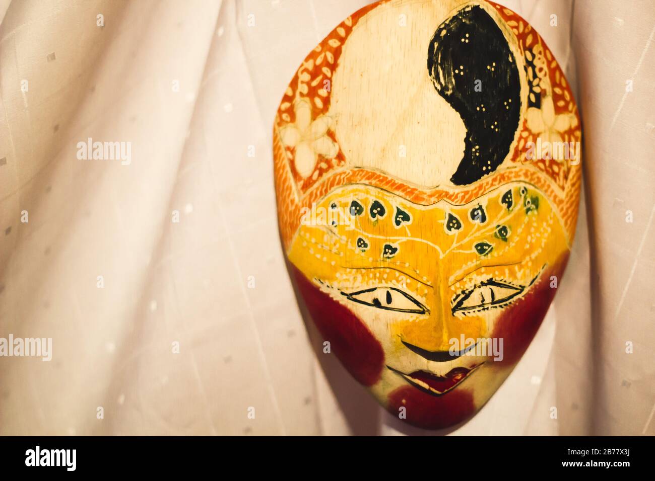 Traditional Dance Acessory: Yellow Indonesian Wayang Mask on a white ...