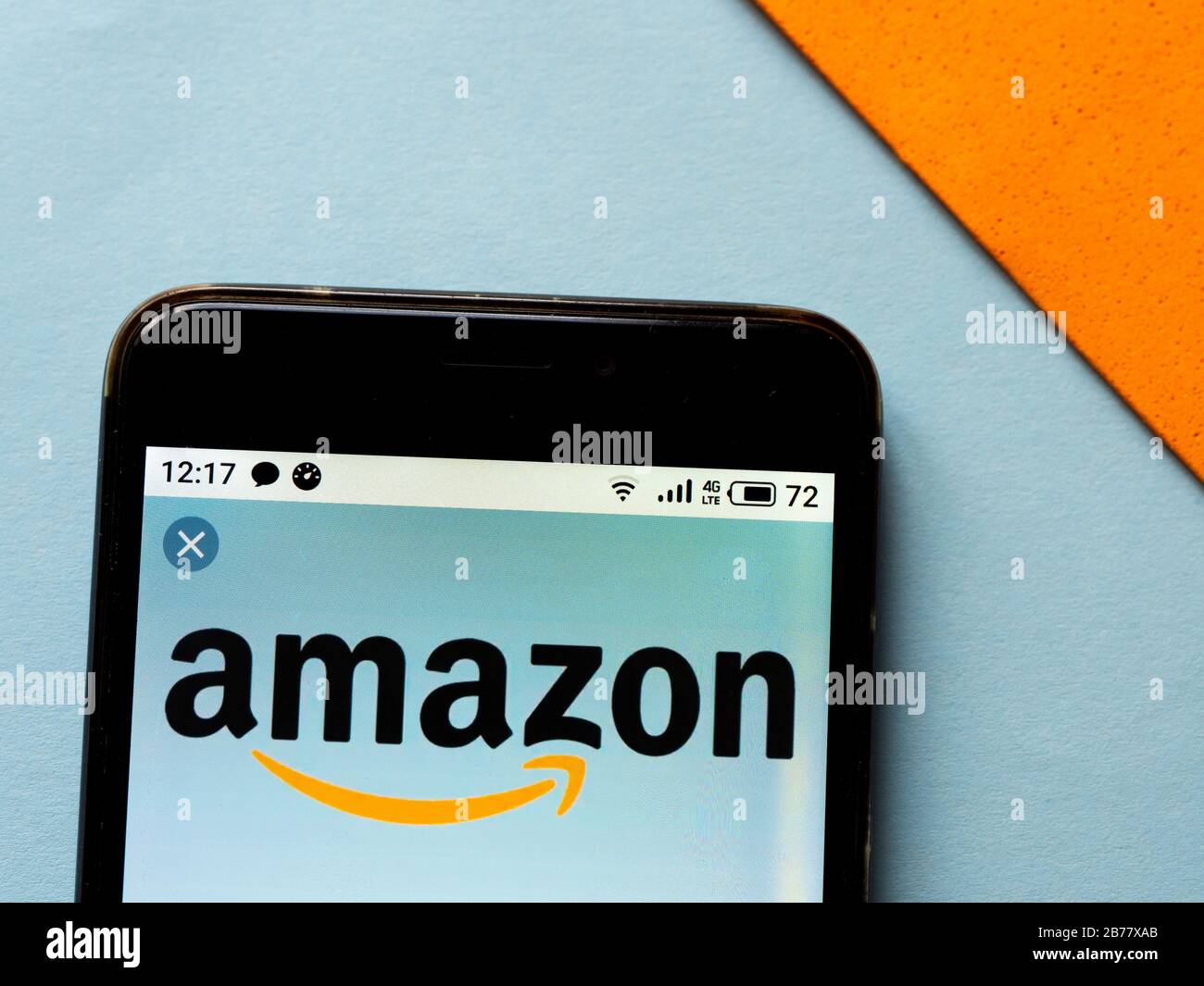 In this photo illustration the Amazon logo is seen displayed on a ...