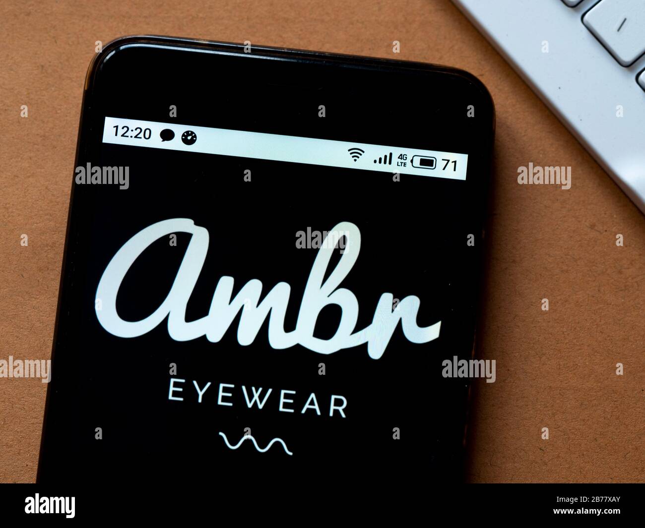 In this photo illustration the Ambr Eyewear logo is seen displayed on a ...