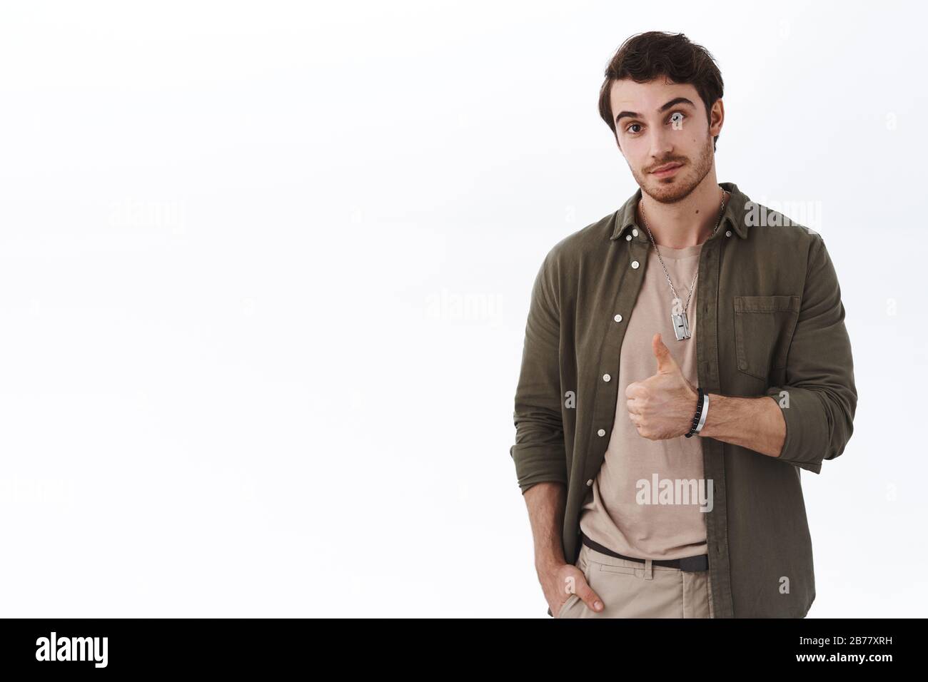 Well done, nice job. Handsome stylish young man with beard, show thumb ...