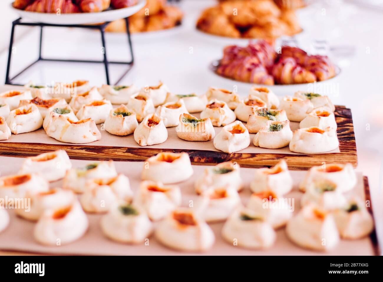 Pastry buffet served at charity event, sweet food and dessert table ...
