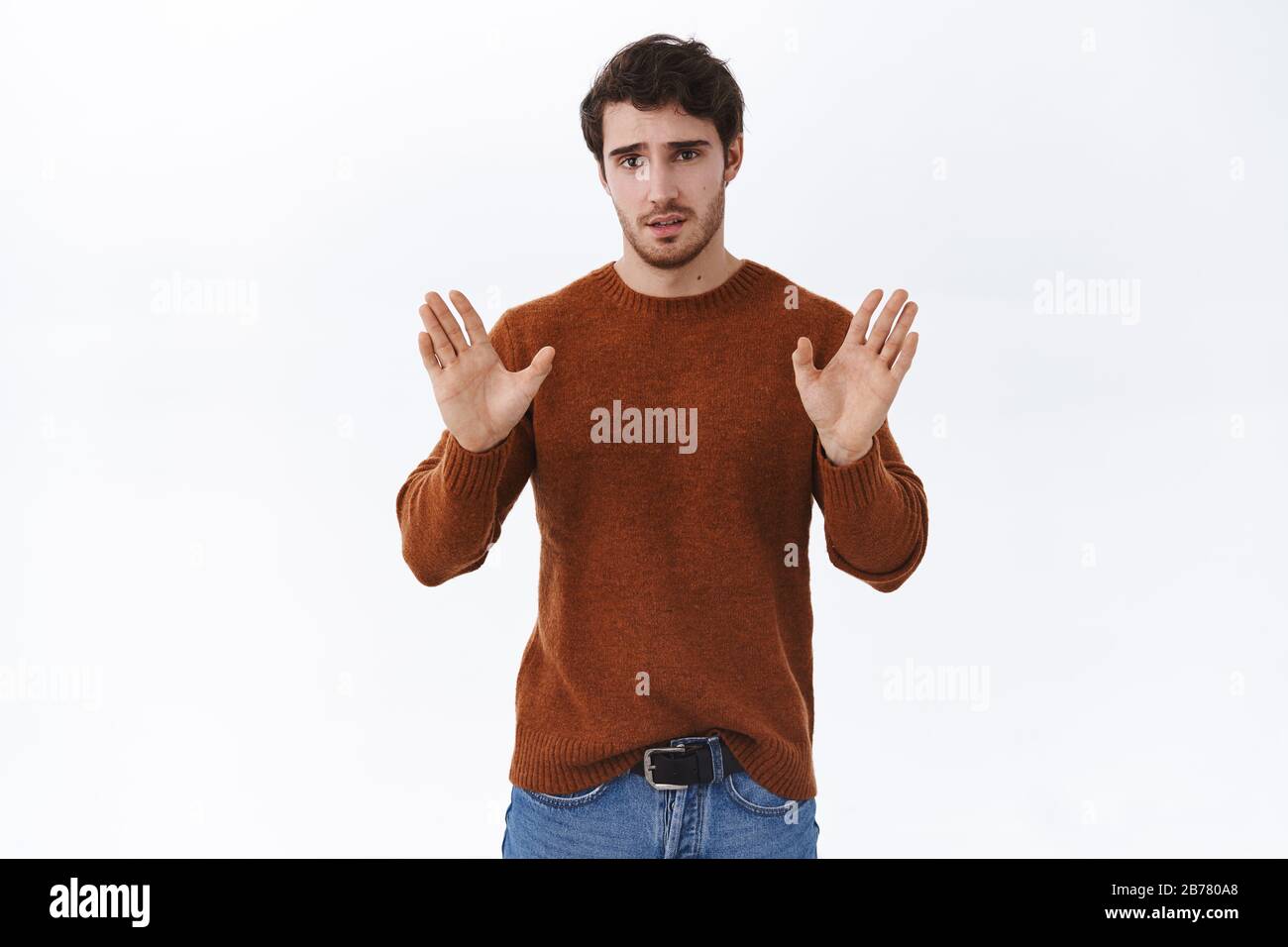 Enough, stop it. Handsome man trying to calm down friend, showing relax ...