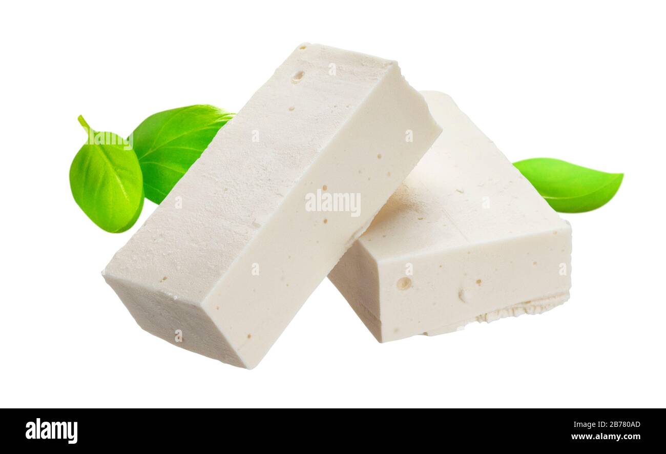 Greek feta. Sliced soft cheese isolated on white background with ...