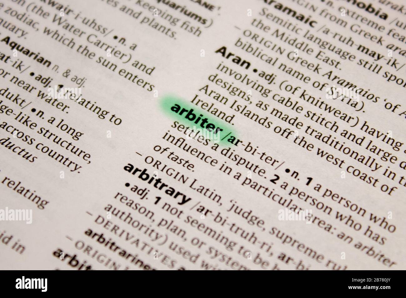Arbiter word or phrase in a dictionary Stock Photo - Alamy
