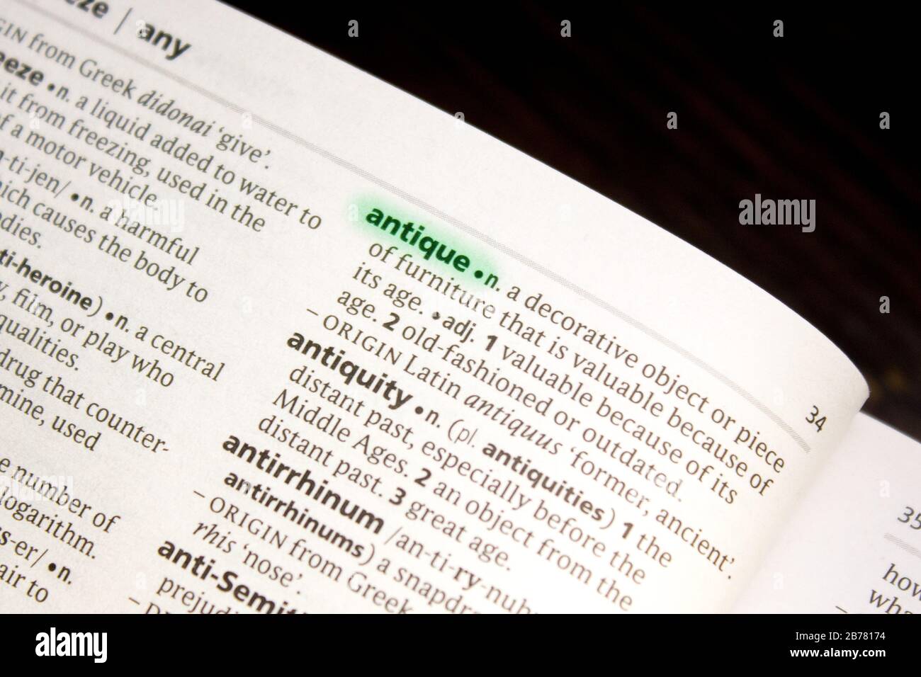 Antique word or phrase in a dictionary Stock Photo - Alamy