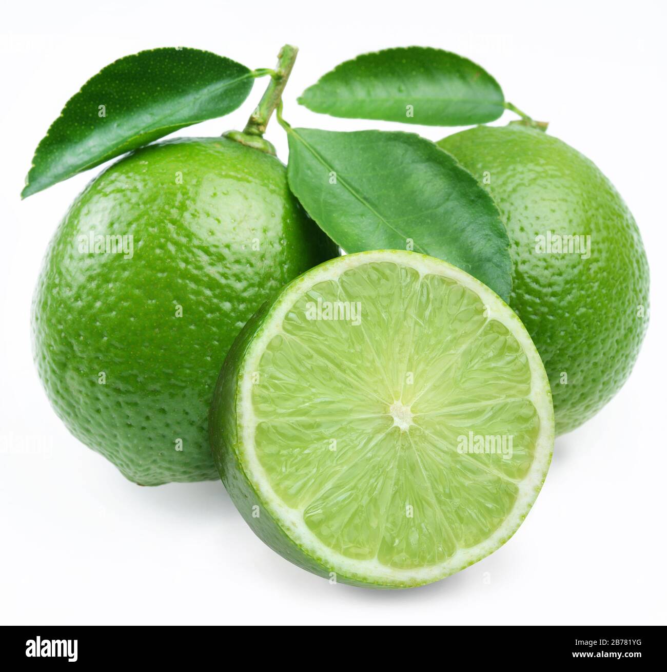 Lime citrus fruit with a slice of lime and leaves isolated on a white ...