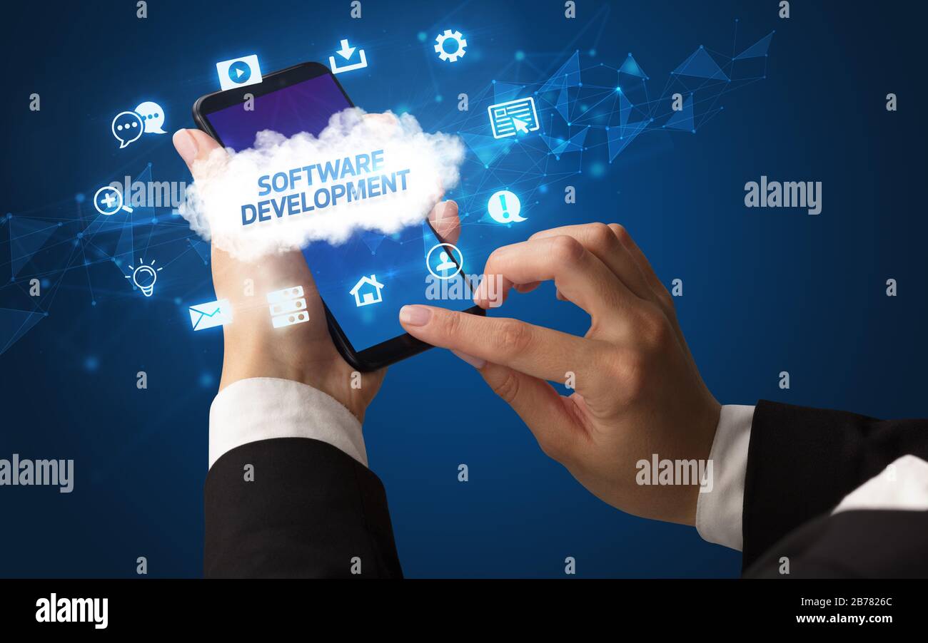 Female hand holding smartphone with SOFTWARE DEVELOPMENT inscription ...