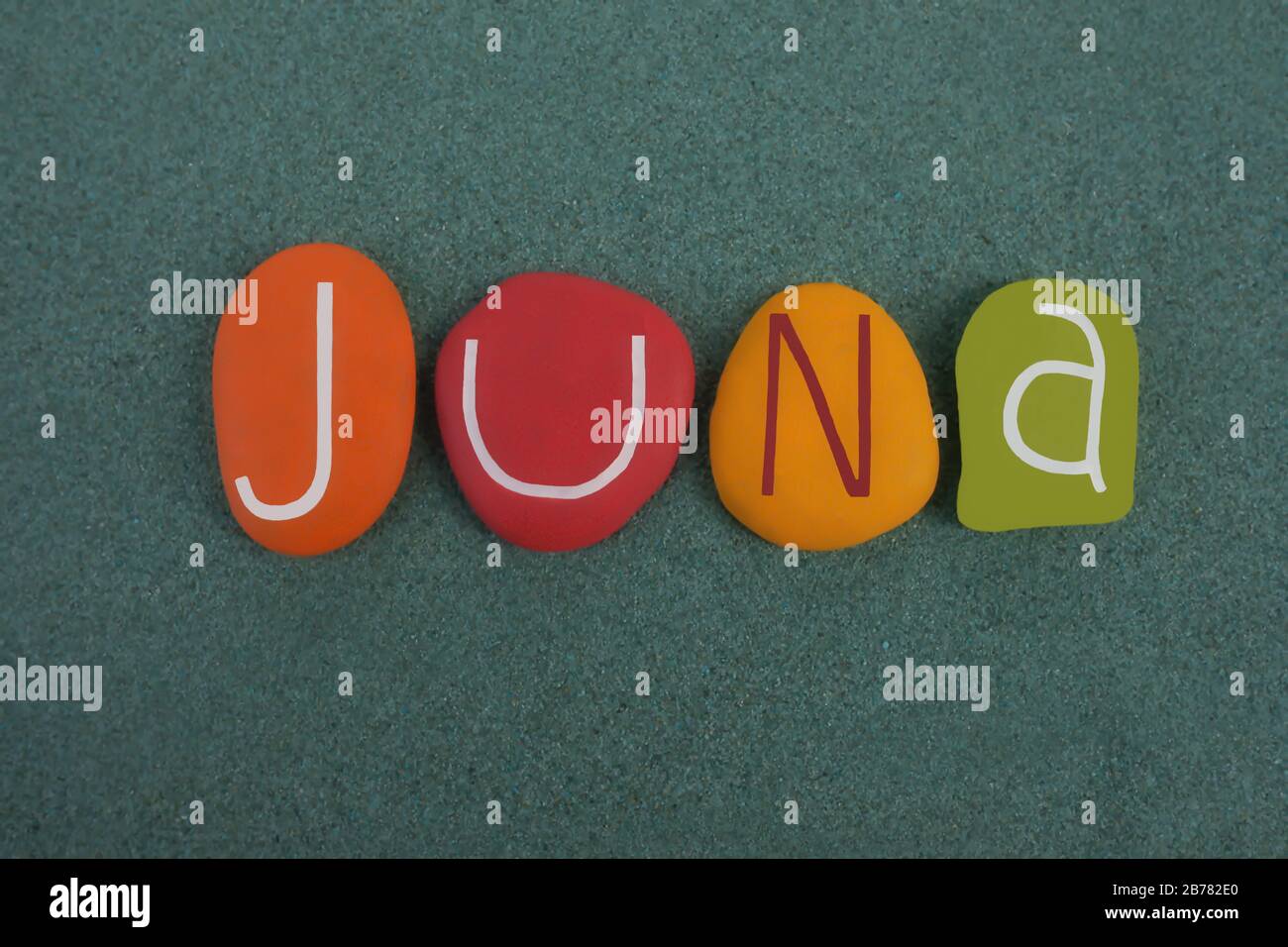 Juna, female given name composed with multi colored stone letters over ...