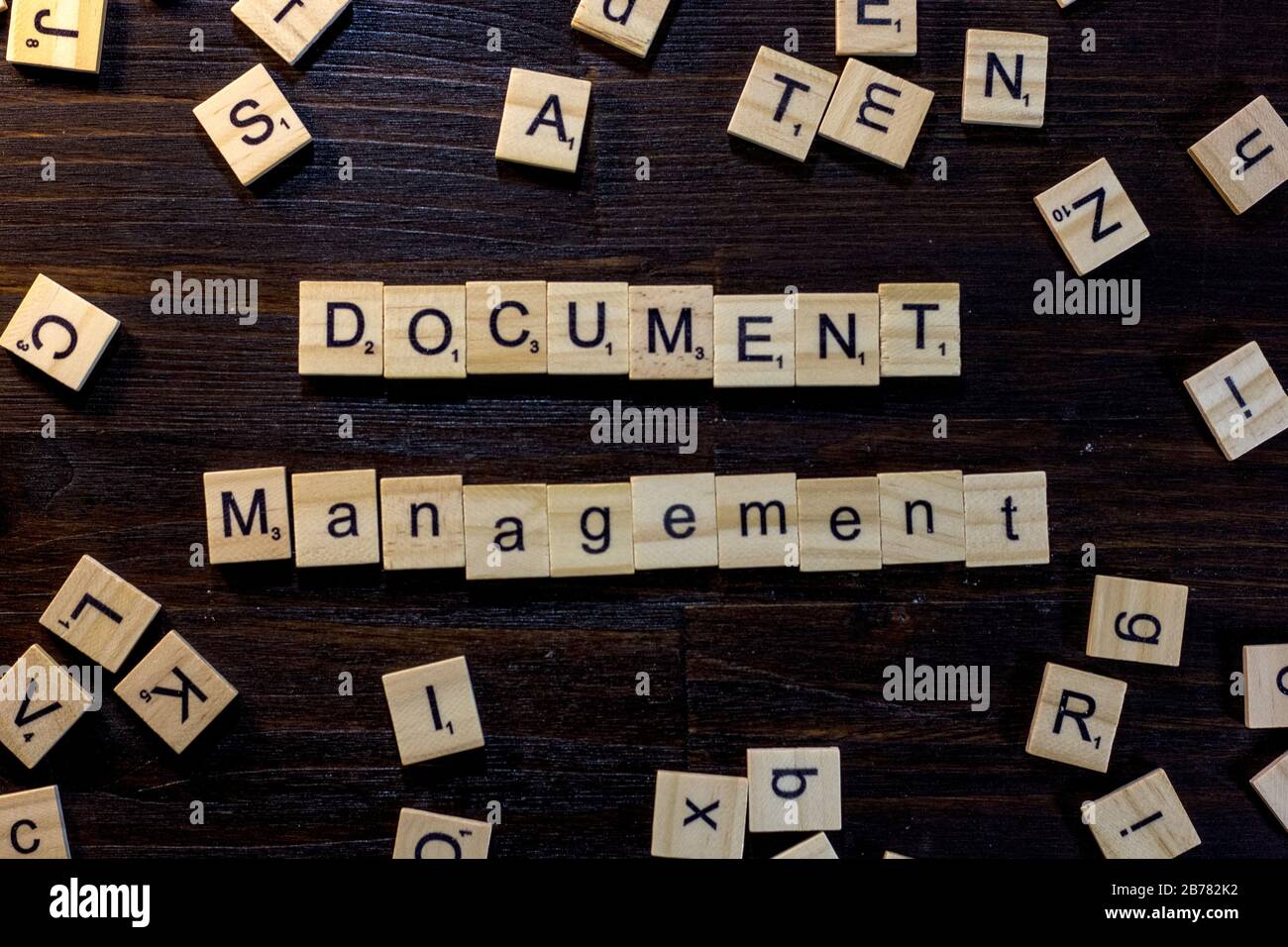 Document Management word made with scrabble letters on a black wooden ...