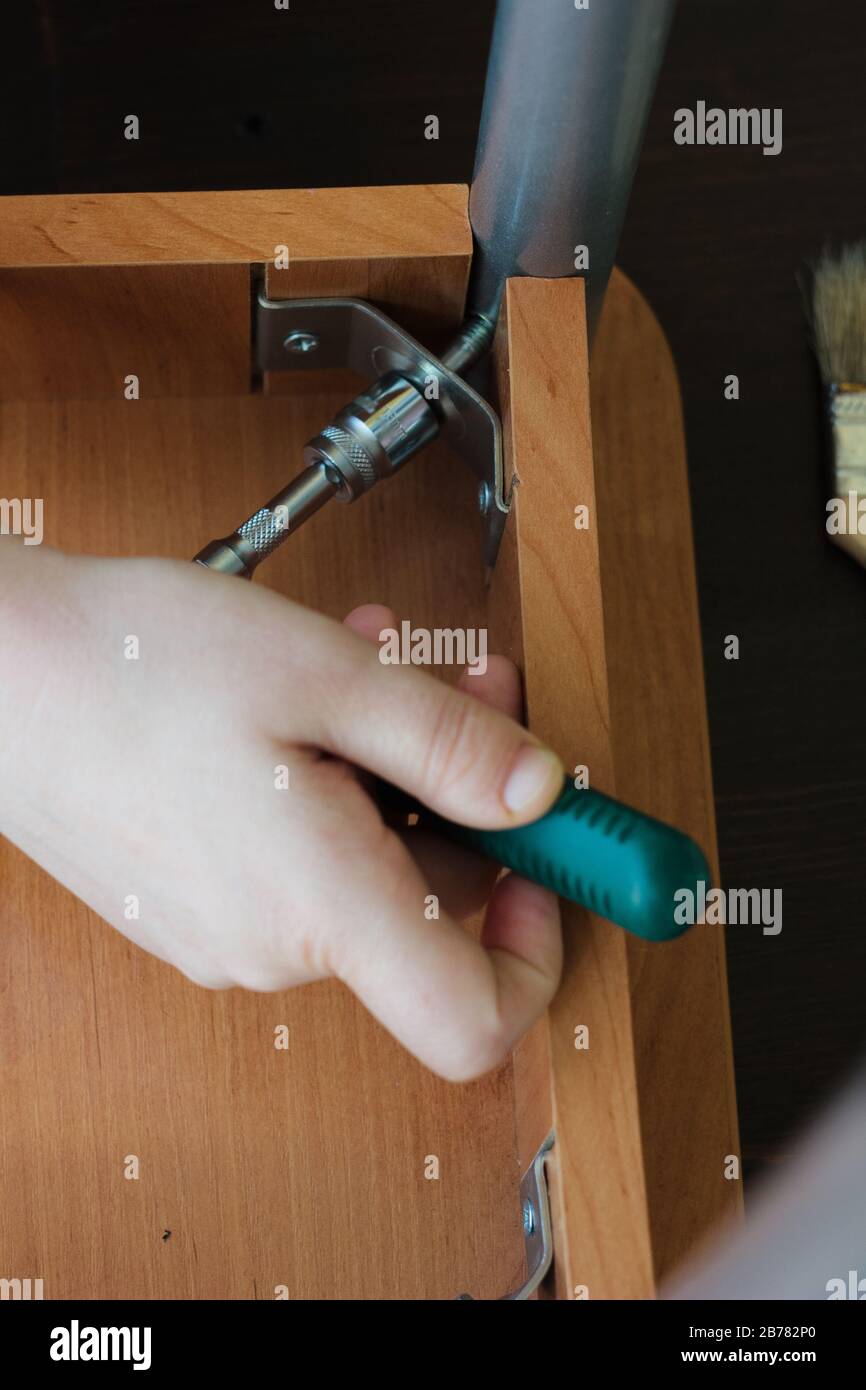 Hands screwing screw socket hi-res stock photography and images - Alamy