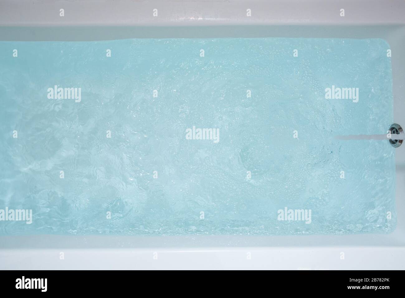 Blue water in the bath. Bathroom. Top view Stock Photo - Alamy