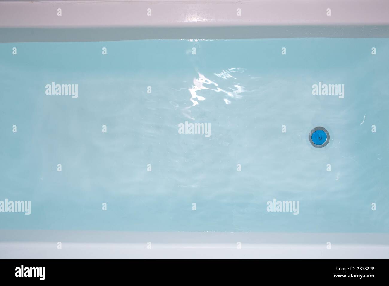 Blue water in the bath. Bathroom. Top view Stock Photo - Alamy