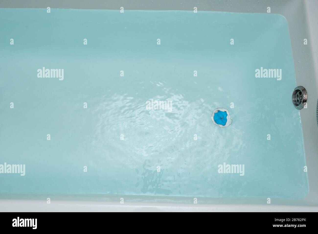 Blue water in the bath. Bathroom. Top view Stock Photo - Alamy