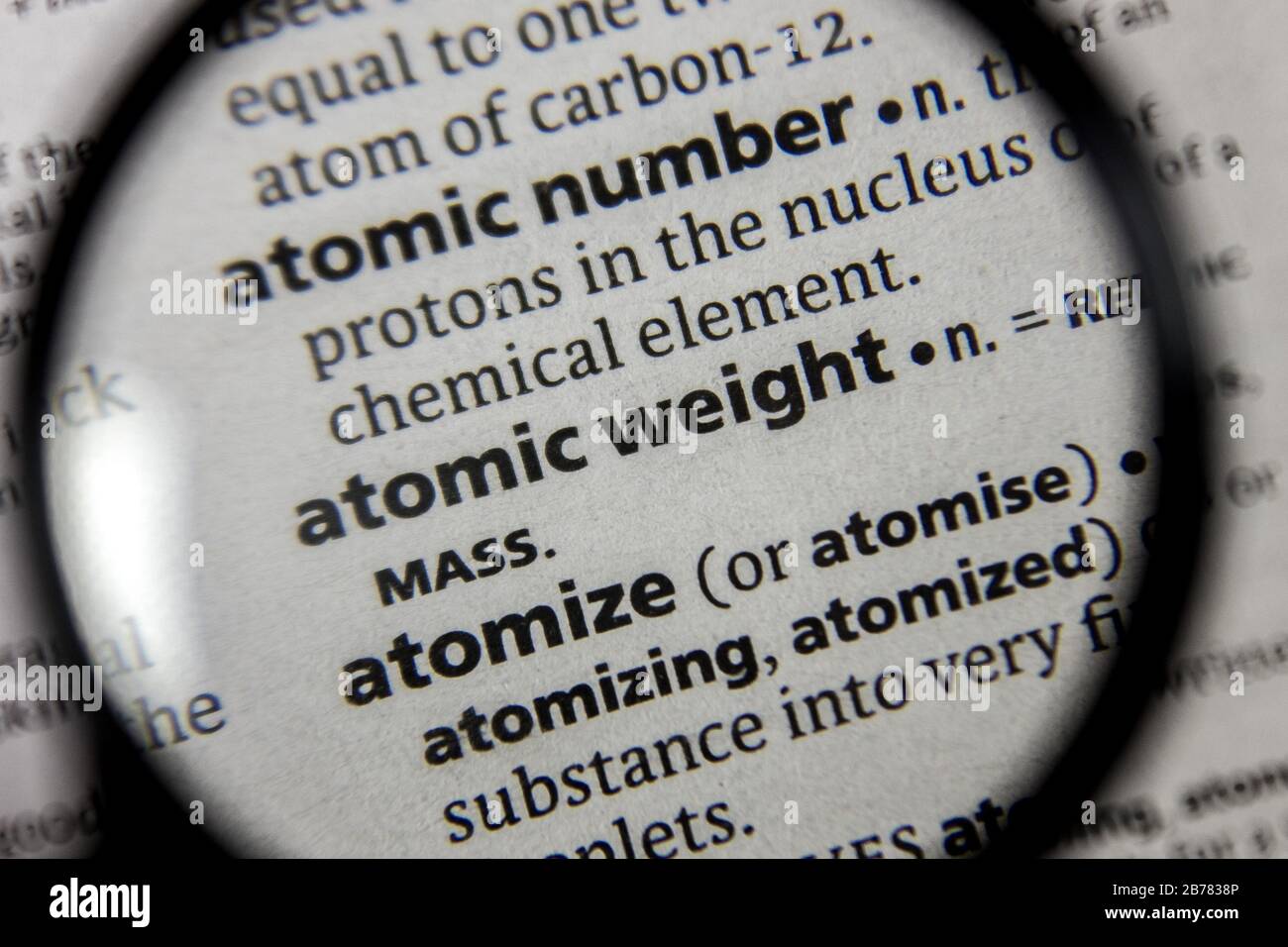 The word or phrase atomic weight in a dictionary book Stock Photo - Alamy