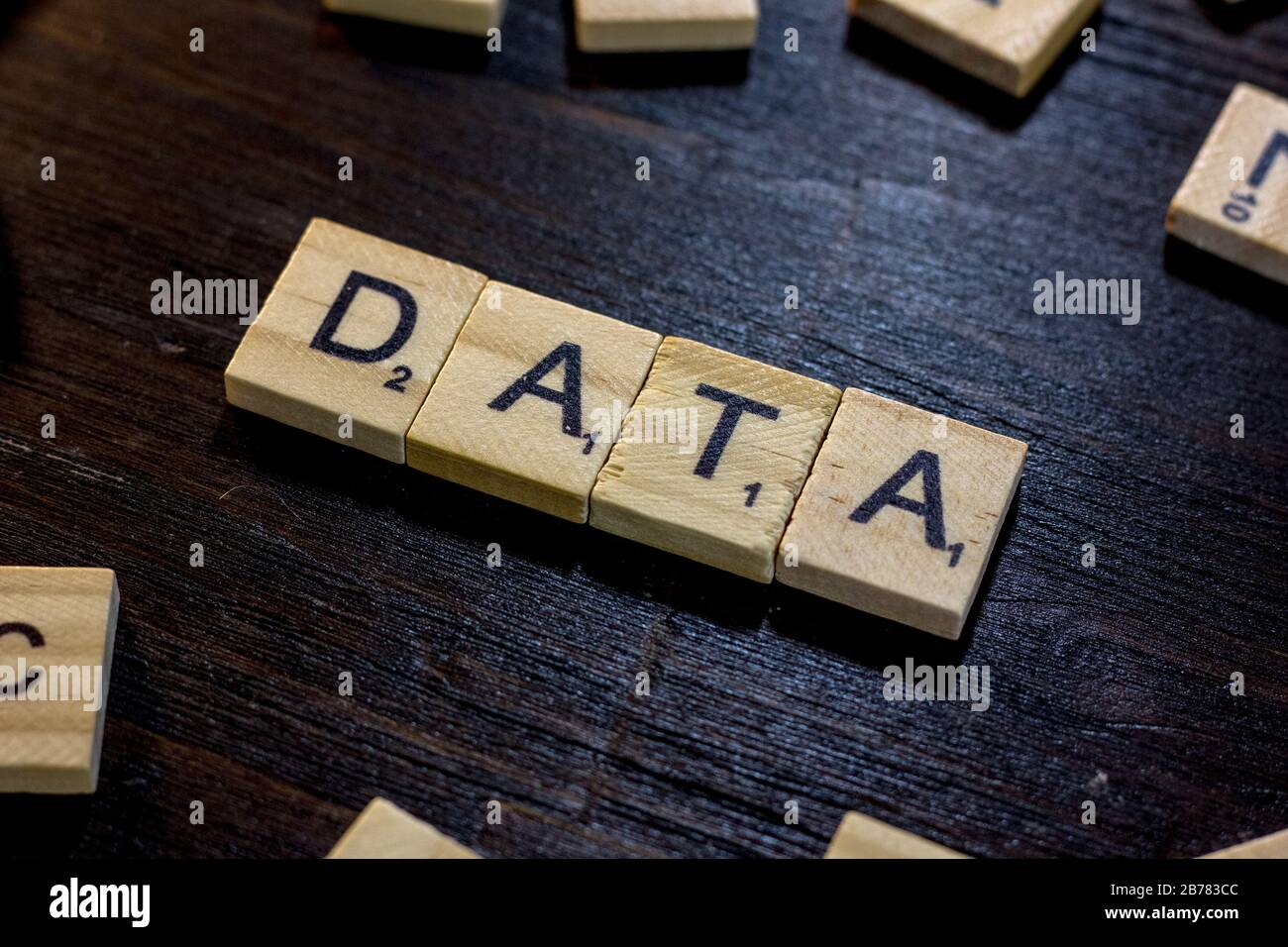 Data word made with scrabble letters on a black wooden table Stock ...