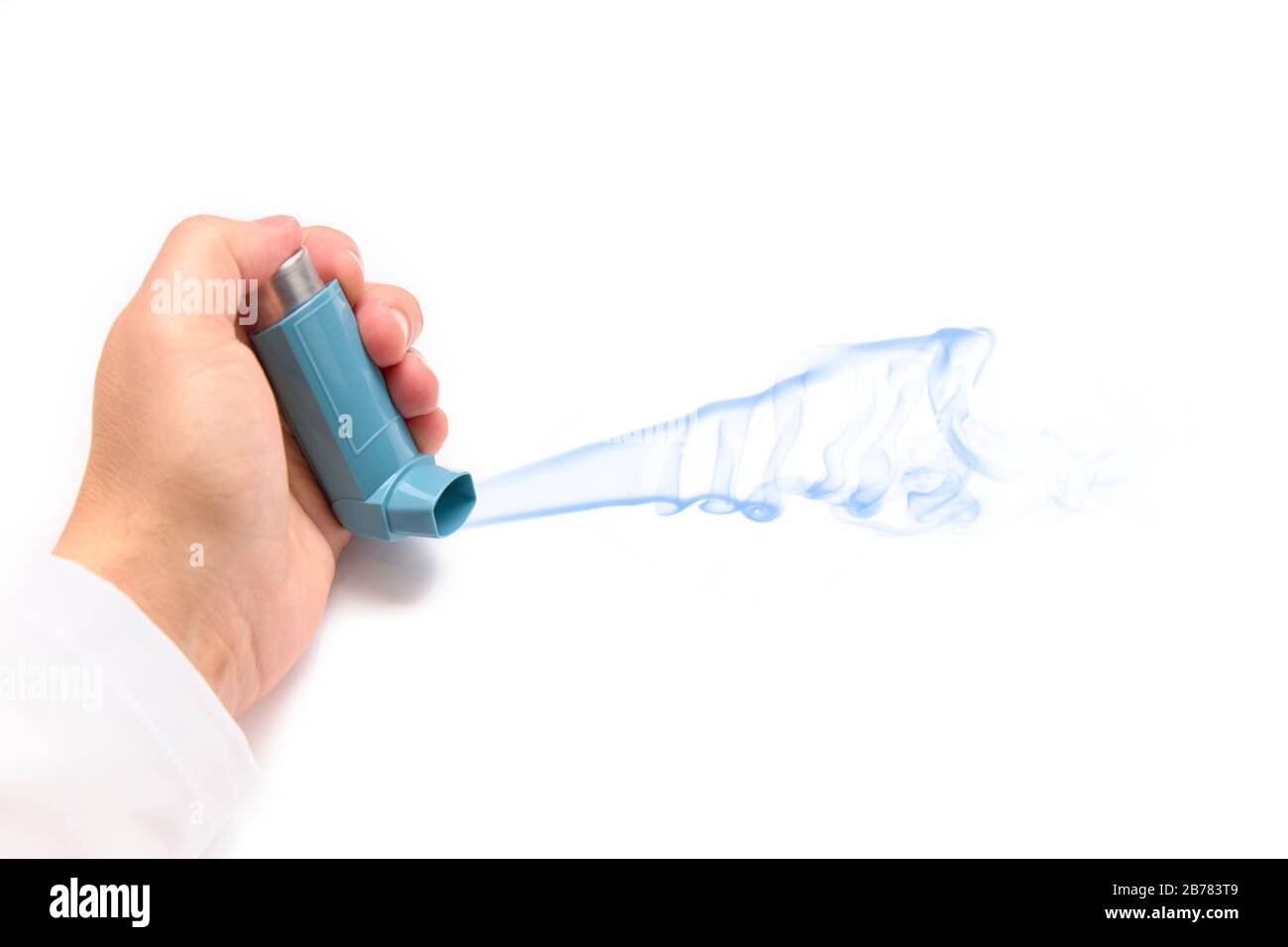 hand with an asthma inhaler on a white background. Concept of health ...