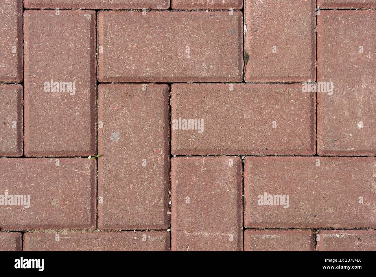 Red pavement stones floor pattern. Top view Stock Photo - Alamy