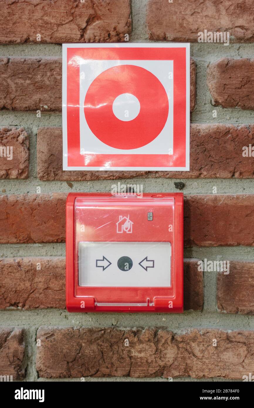 Fire alarm button in emergency system over a wall Stock Photo - Alamy